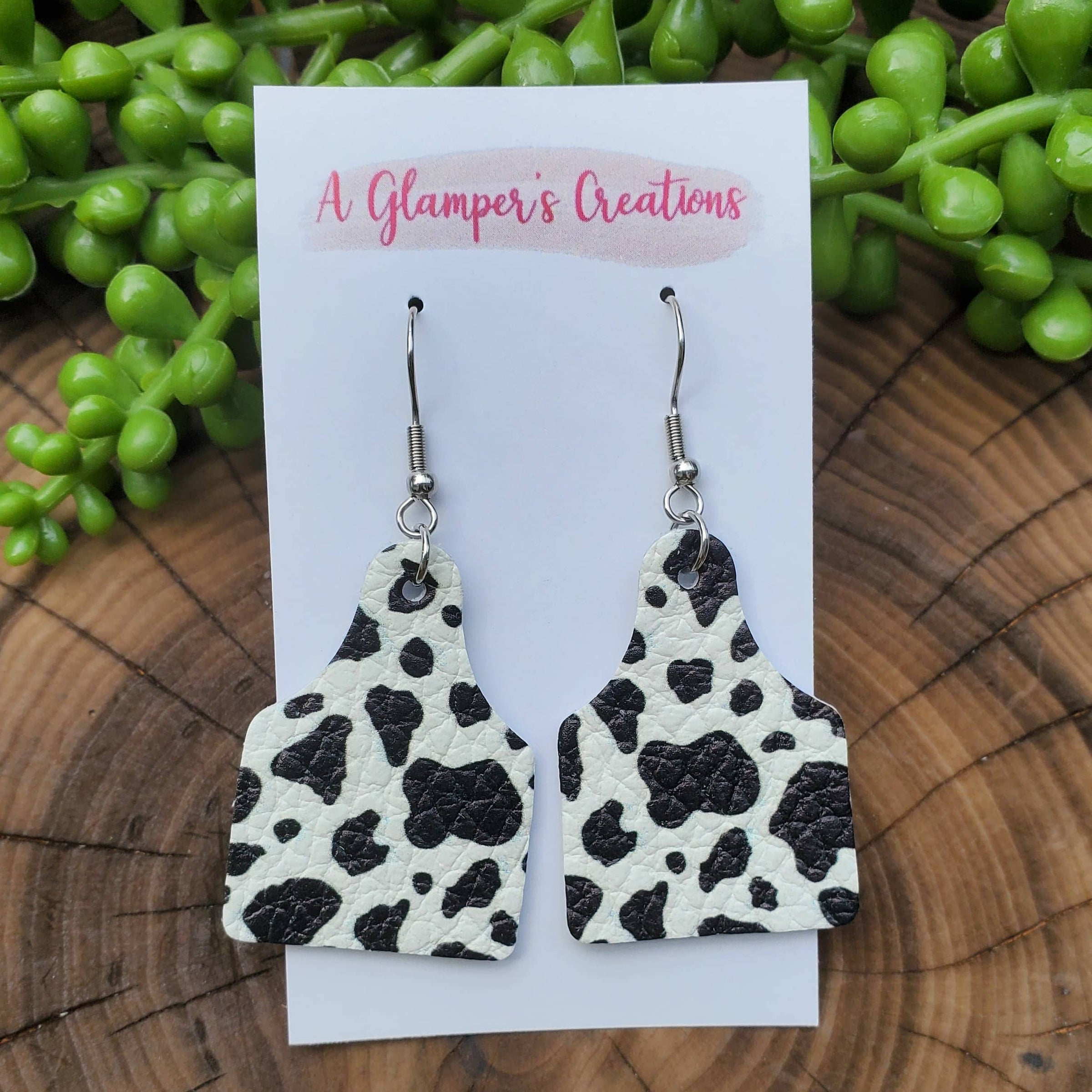 A Glamper s Creations LLC Black White Cow Print Cow Tag Leather Earrings